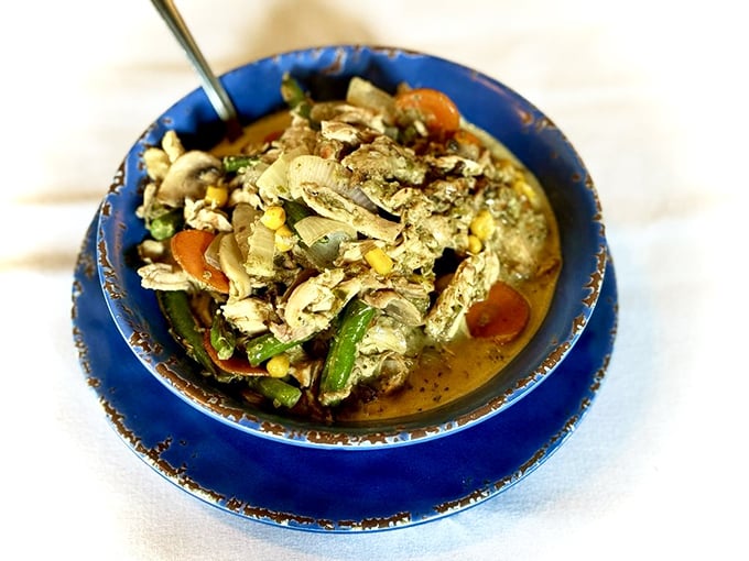 A vibrant bowl of curry packed with fresh vegetables and tender chicken—proof that comfort food speaks a universal language.