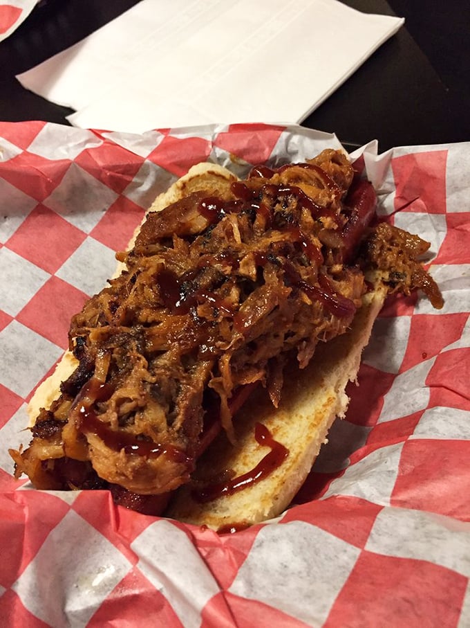 This isn't just a hot dog—it's a meat symphony where pulled pork plays first chair. The sauce adds that perfect sweet-tangy crescendo.