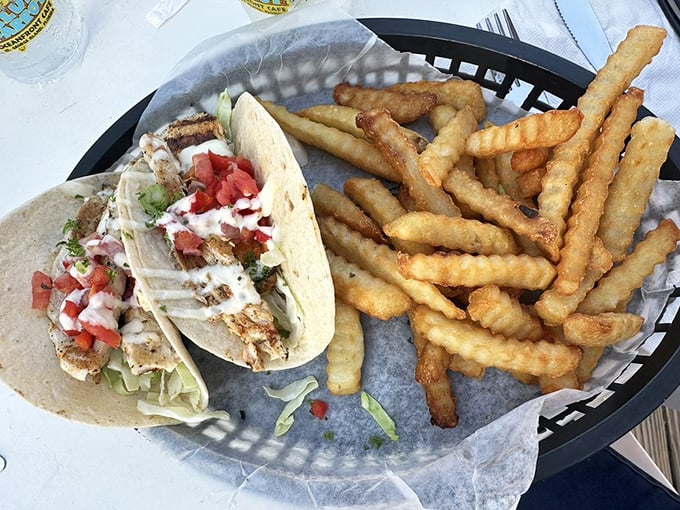 Fish tacos and fries—the ultimate beach combo that makes you question why you ever eat lunch indoors or wear business casual.