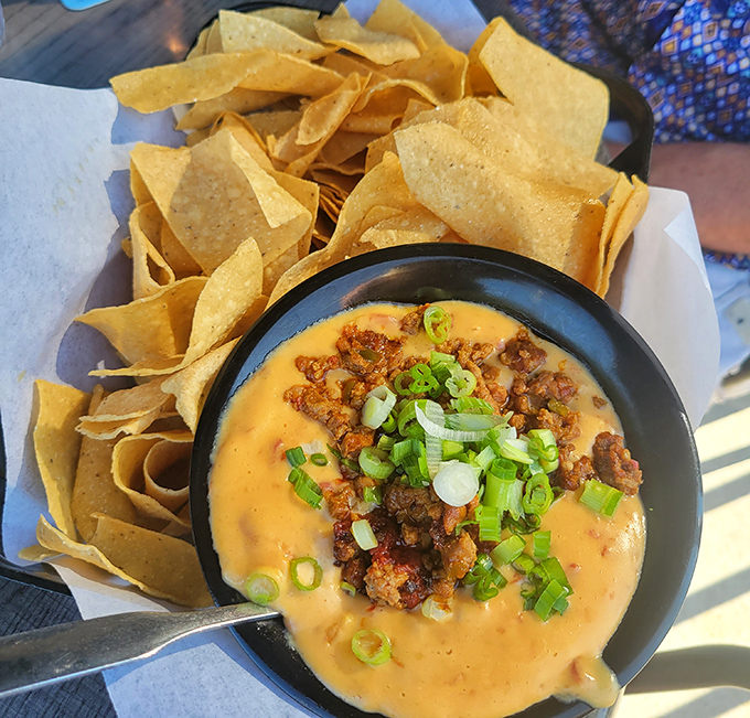 This queso dip isn't just melted cheese—it's a warm, spicy hug in a bowl with seasoned beef playing the role of unexpected hero.