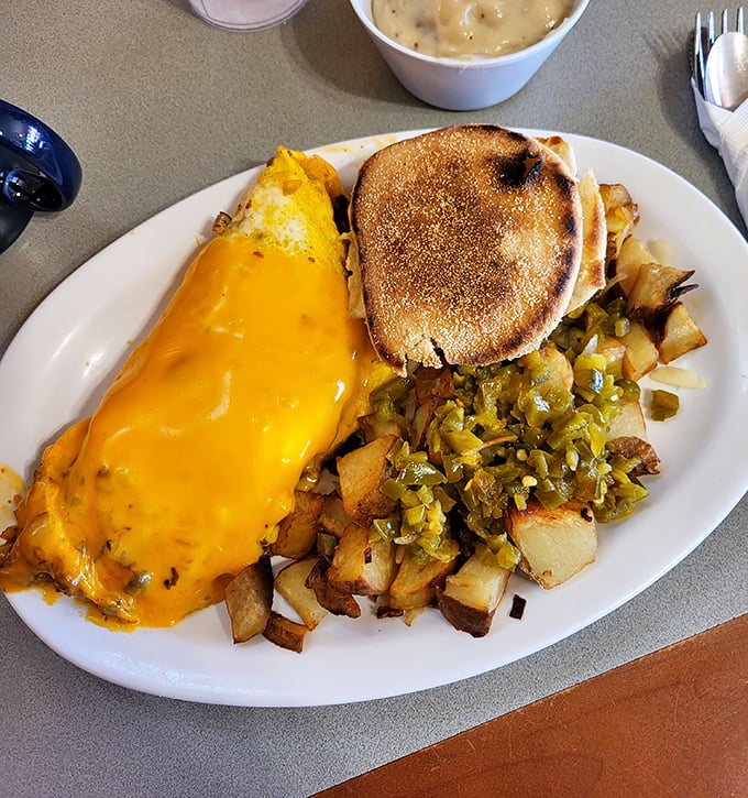 An omelet smothered in cheese, potatoes crisped to perfection, and green chilies adding that Southwestern kick—breakfast in Arizona doesn't get more authentic than this.