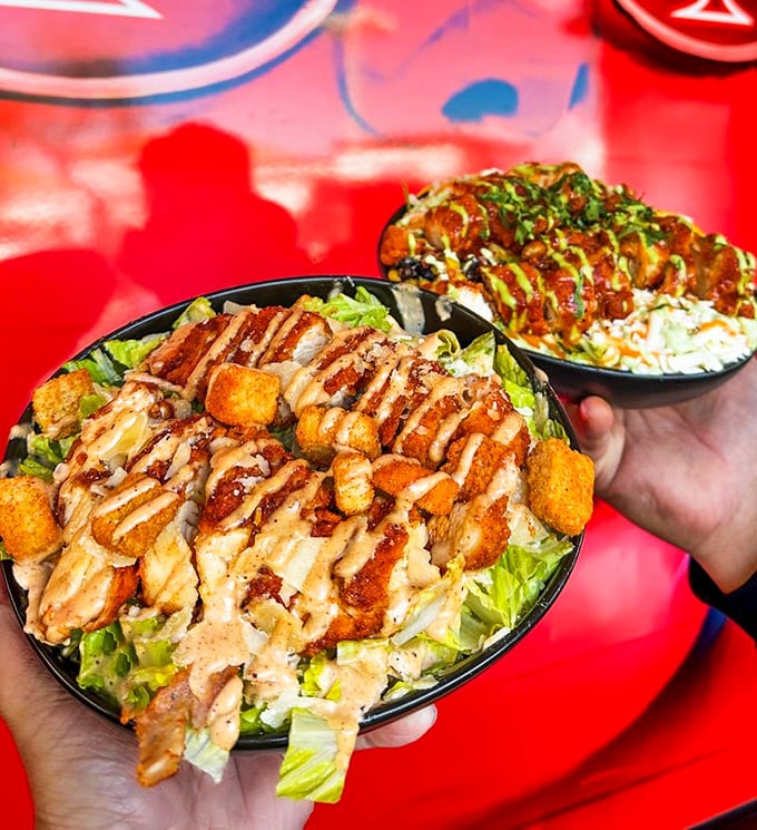 These chicken bowls aren't just meals, they're masterpieces – where crisp lettuce provides cooling refuge from the spicy chicken storm.