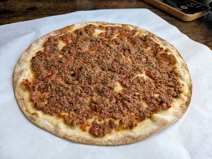 The humble flatbread reimagined as a canvas for savory artistry—this lahmacun proves that sometimes the simplest dishes speak the loudest.