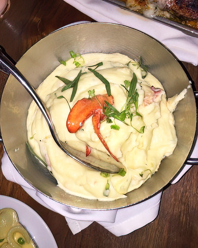 These aren't your ordinary mashed potatoes—they're a silky cloud of potato perfection studded with sweet lobster meat, like the Rolls Royce of side dishes.