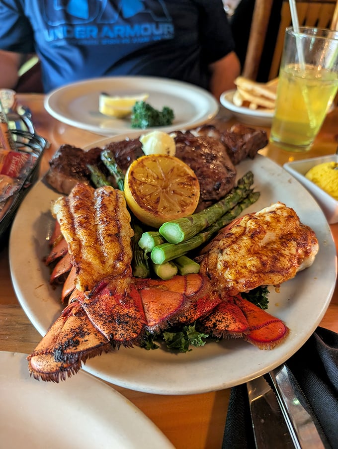 The surf and turf that launched a thousand special occasions—lobster tails and steak sharing a plate like old friends at a reunion.