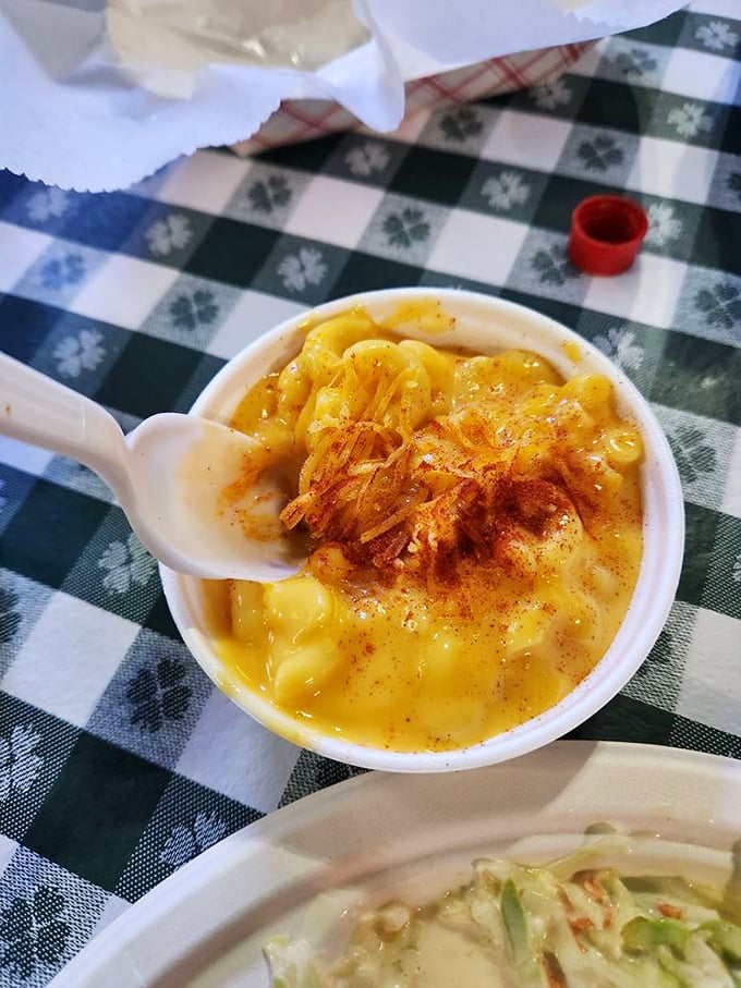Mac and cheese that doesn't try to reinvent itself with truffle oil or lobster—just creamy, cheesy perfection with a dusting of paprika.
