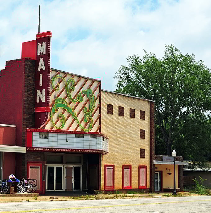The vintage Main Theater marquee glows with nostalgic charm. In an age of streaming, this landmark reminds us why movies are better with popcorn and community.