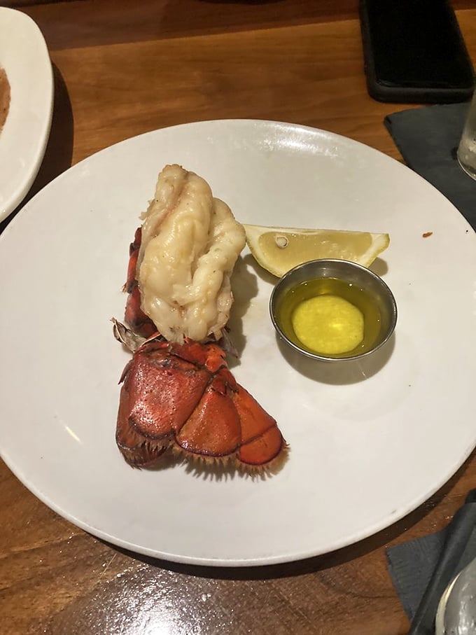 Maine lobster tail gets the royal treatment it deserves, complete with drawn butter and lemon wedge.