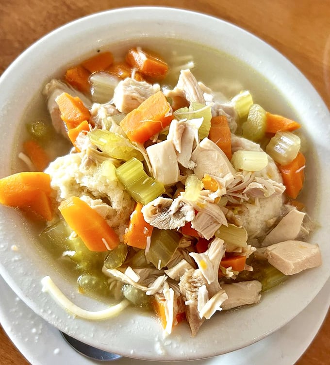 Chicken soup for more than just the soul—chunks of meat, vegetables, and matzo balls swimming in golden broth that grandmothers everywhere would approve of.
