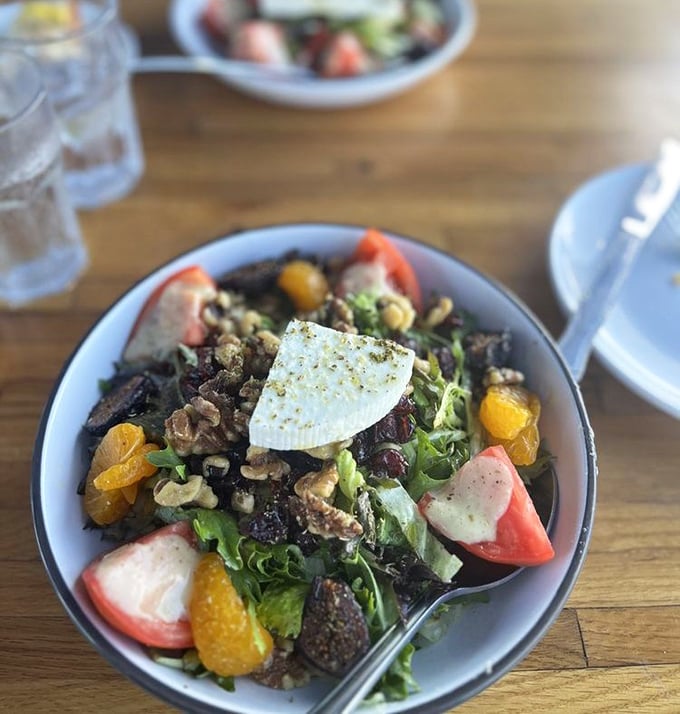 A Mediterranean salad that actually tastes like sunshine. The feta doesn't ask for attention – it commands it, like a Greek chorus leader.