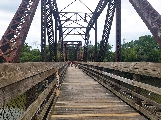 This historic iron bridge spans more than just water—it connects Danville's industrial past with its recreational present through weathered wood and sturdy steel.