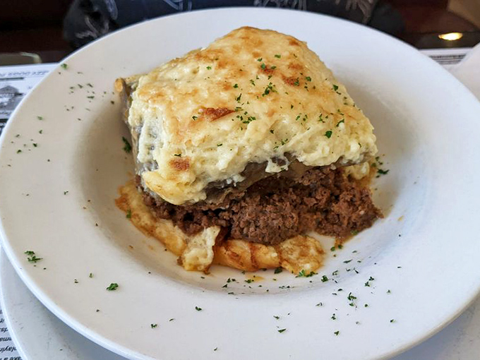 Comfort food elevated – layers of savory goodness topped with a golden blanket of cheese that makes you wonder why you'd ever order anything else.