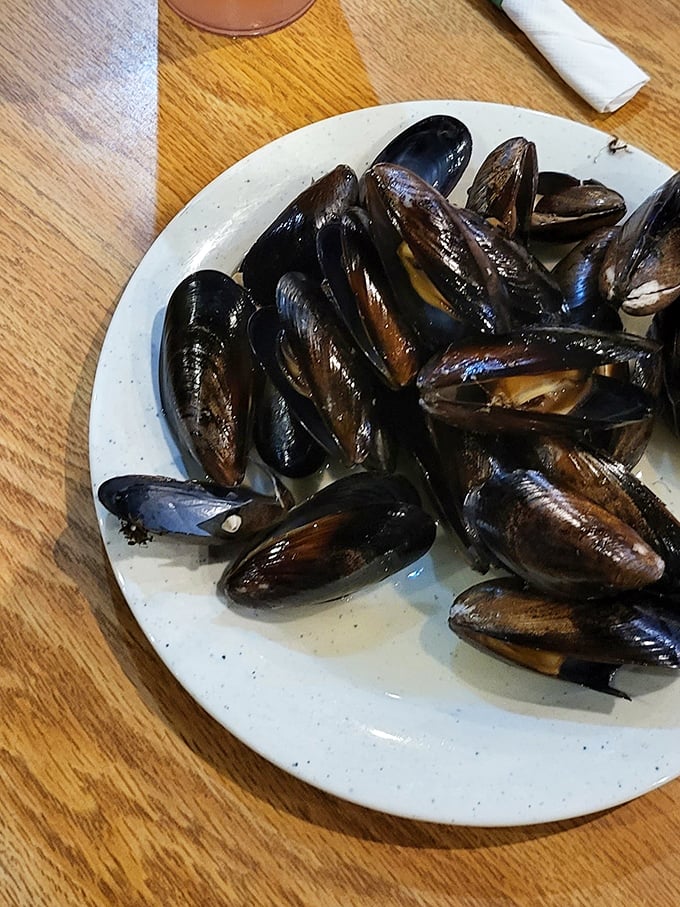 These glistening mussels might be the unsung heroes of the seafood station – tender morsels of oceanic flavor that reward the adventurous buffet navigator.