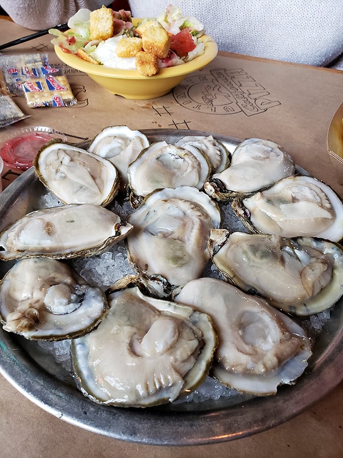 Fresh oysters on the half shell, glistening like jewels on a bed of ice—nature's perfect appetizer just waiting for a squeeze of lemon.
