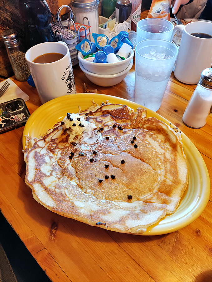 A simple pancake with butter becomes an extraordinary experience when paired with their robust coffee in a signature mug.