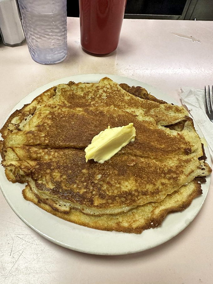 This pancake doesn't need Instagram filters—it's already got that golden-brown glow that says "I was made by someone who cares."