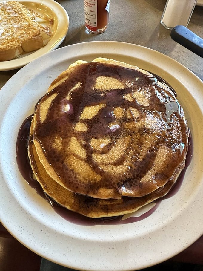 These pancakes aren't just breakfast—they're edible frisbees of happiness, absorbing maple syrup like they were engineered specifically for this purpose.