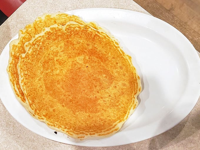 The perfect pancake isn't just about ingredients—it's about technique. This golden disc proves someone in that kitchen knows exactly what they're doing.