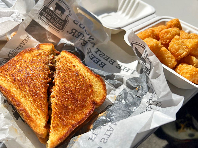 The grilled cheese and tots combo—comfort food that whispers, "Everything's going to be okay," even when your 401k suggests otherwise.