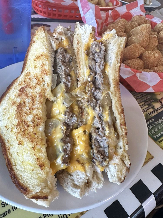 The patty melt—where burger meets grilled cheese in a beautiful union that would make cupid himself weep with joy.