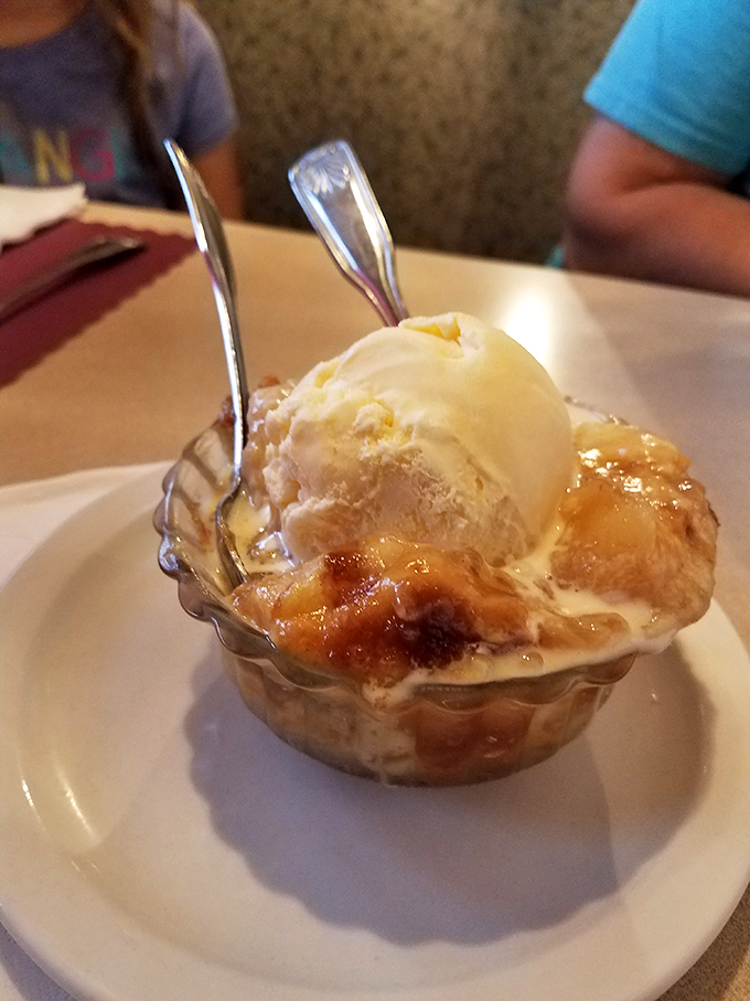 This isn't just peach cobbler – it's summer childhood memories topped with vanilla ice cream slowly creating rivers of sweet nostalgia.