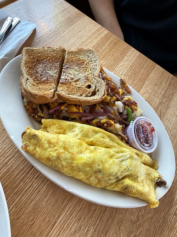 The omelet that couldn't decide between breakfast and Philadelphia, so it became both. Cheese steak filling wrapped in egg perfection.
