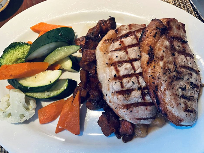 Perfectly grilled pork complemented by vibrant vegetables—proof that sometimes the simplest preparations yield the most profound flavors.