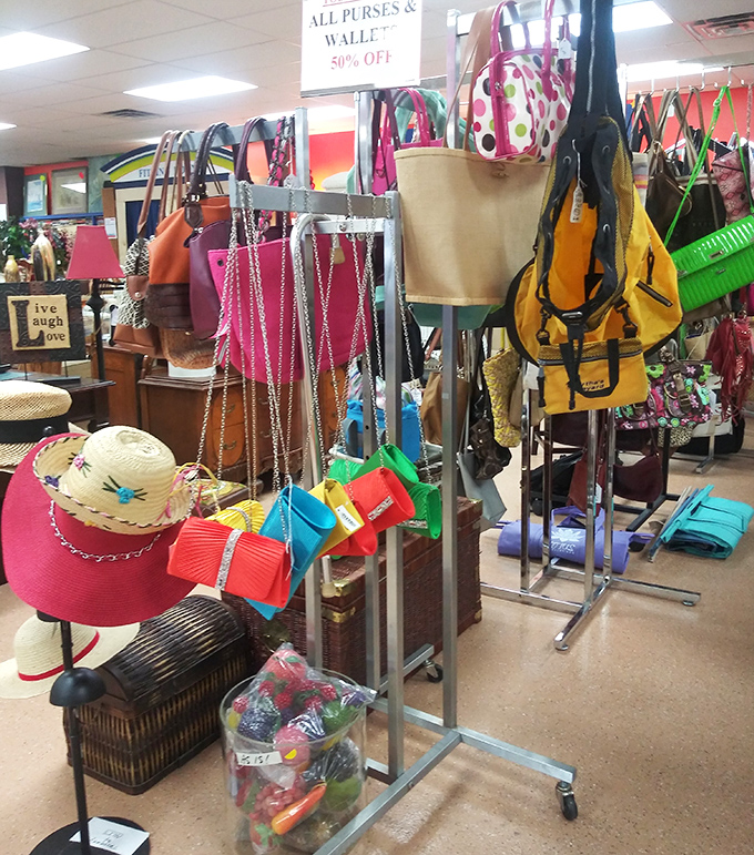 The handbag display—a colorful congregation where designer lookalikes mingle with beach totes, all vying for your attention and closet space.