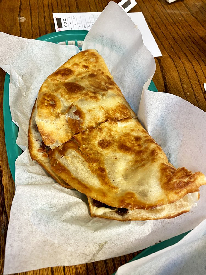 The humble quesadilla elevated to art form. Golden-brown, crispy exterior giving way to molten cheese—proof that simplicity, when done right, is revolutionary.
