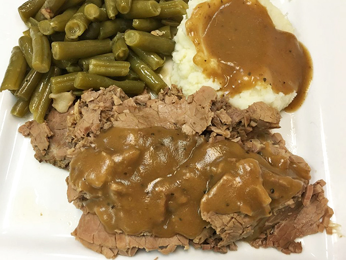 Roast beef that doesn't just melt in your mouth—it tells a story of patience, proper seasoning, and the kind of gravy that deserves its own fan club.