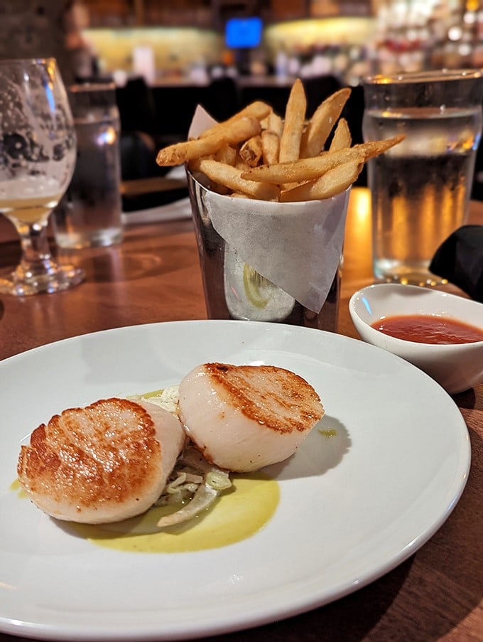 Scallops seared to that magical caramelized exterior while maintaining their buttery interior – the culinary equivalent of threading a needle while skydiving.