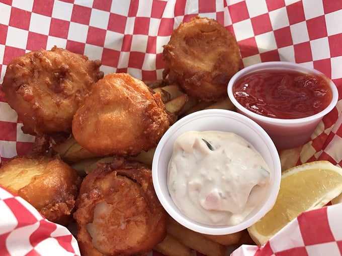 These golden-fried scallops aren't just seafood—they're little crispy-edged treasures from the deep, perfect for dipping in house-made tartar sauce.