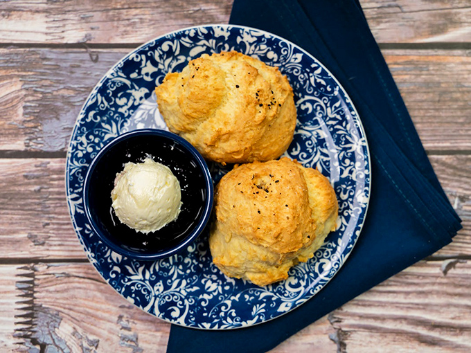 These biscuits don't just rise—they ascend to a higher plane of buttery existence, waiting for their heavenly companion of honey.