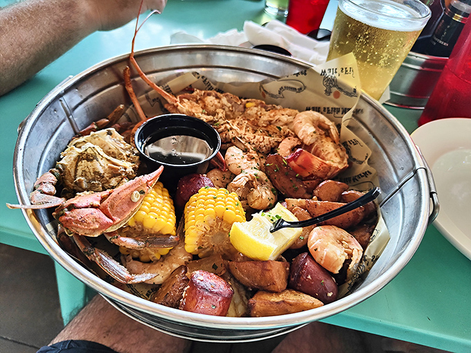 The seafood boil at Walt's isn't just a meal, it's an event—a glorious metal bucket of "I'll worry about my cholesterol tomorrow."
