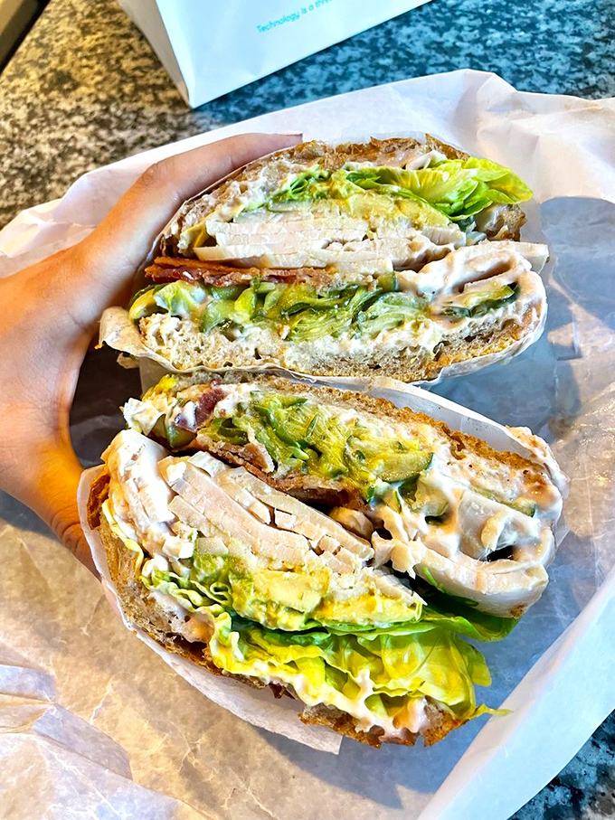 This sandwich doesn't just satisfy hunger—it creates memories. Turkey and egg combine in a breakfast-meets-lunch creation that deserves its own holiday.