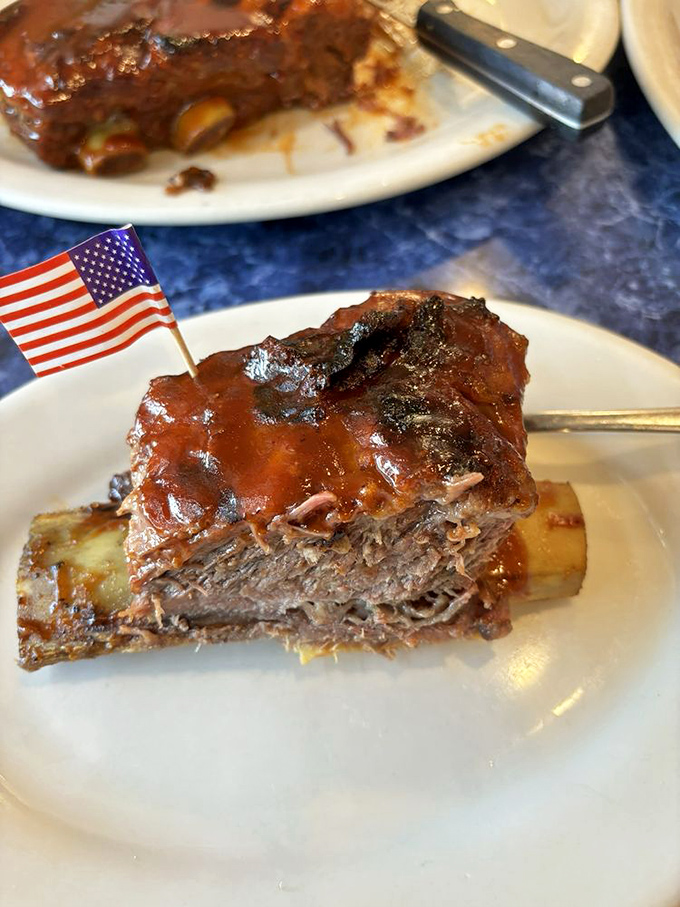 These short ribs aren't just fall-off-the-bone tender—they've already fallen, surrendered, and raised a tiny American flag in delicious defeat.