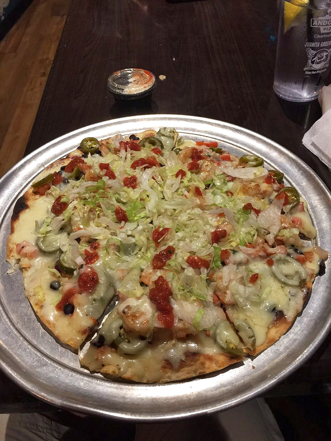 Someone clearly got their PhD in Proper Pizza Architecture—this pie balances toppings with the precision of a culinary tightrope walker.