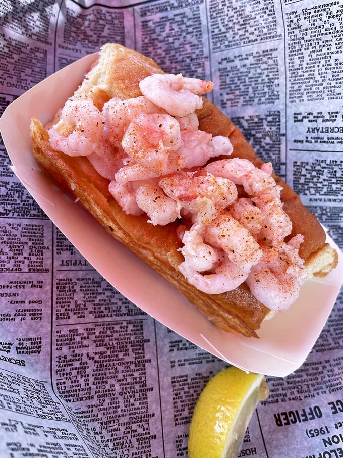 Don't let its delicate appearance fool you—this shrimp roll packs flavor that could make a New Englander weep with joy. Newspaper underneath? That's authenticity you can taste.