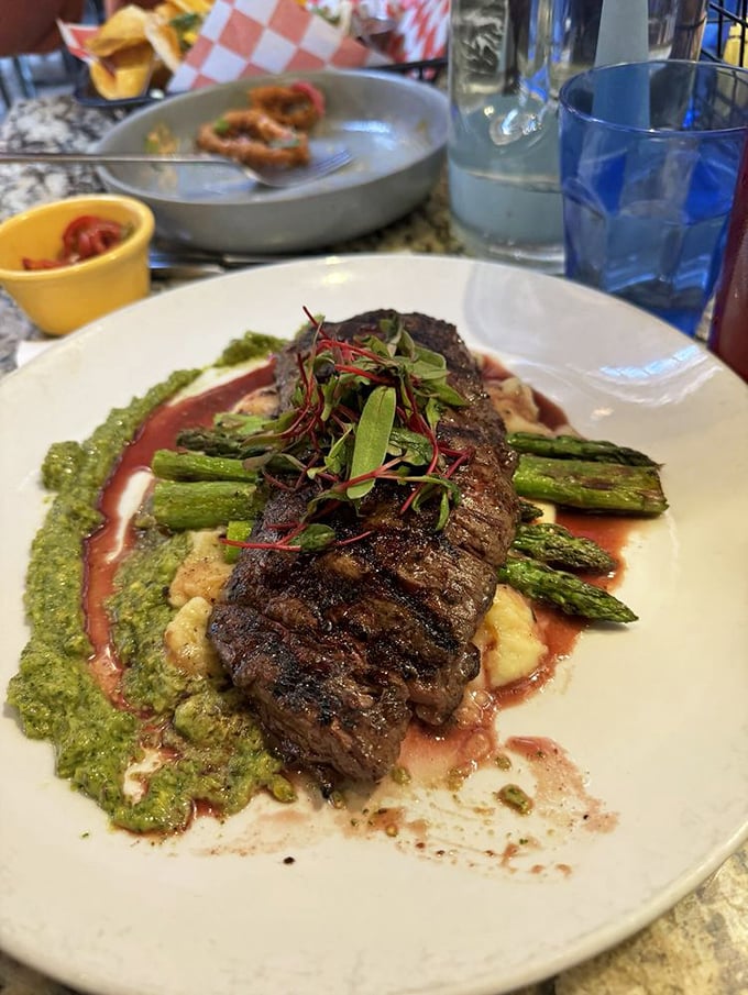 This steak isn't just cooked—it's been sweet-talked to perfection. Those asparagus spears are standing at attention for good reason.