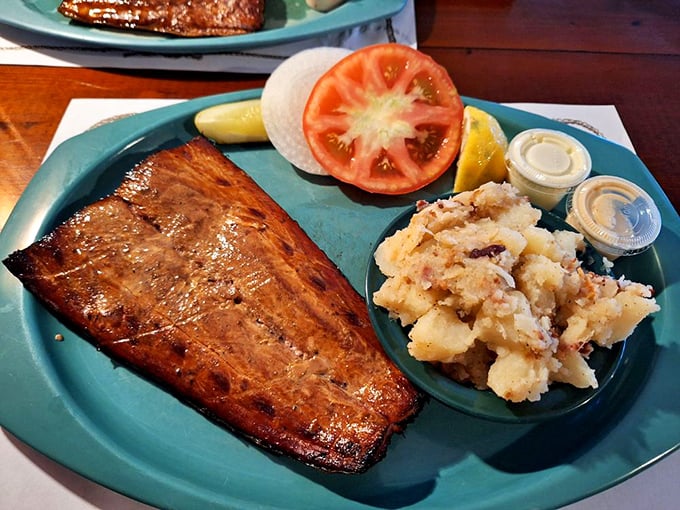 The mahi-mahi arrives like a smoky postcard from paradise, accompanied by German potato salad that could make a Bavarian grandmother nod in approval.