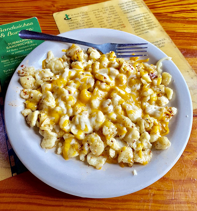 Mac and cheese's sophisticated cousin—spaetzle and cheese—looking like a golden blanket of comfort that's worth every delicious calorie.