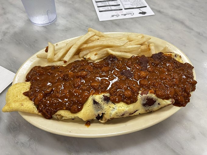 Not so much an omelet as a declaration of breakfast independence—smothered in chili that means serious business.