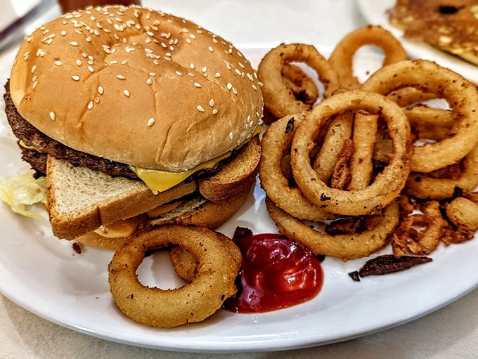 The humble cheeseburger, elevated not by truffle oil or artisanal nonsense, but by the simple dignity of being made right.