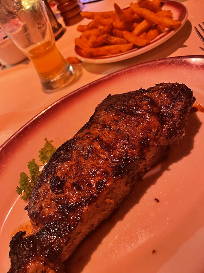 This strip steak's caramelized crust should have its own Instagram account. Those golden fries aren't just sidekicks—they're worthy co-stars.