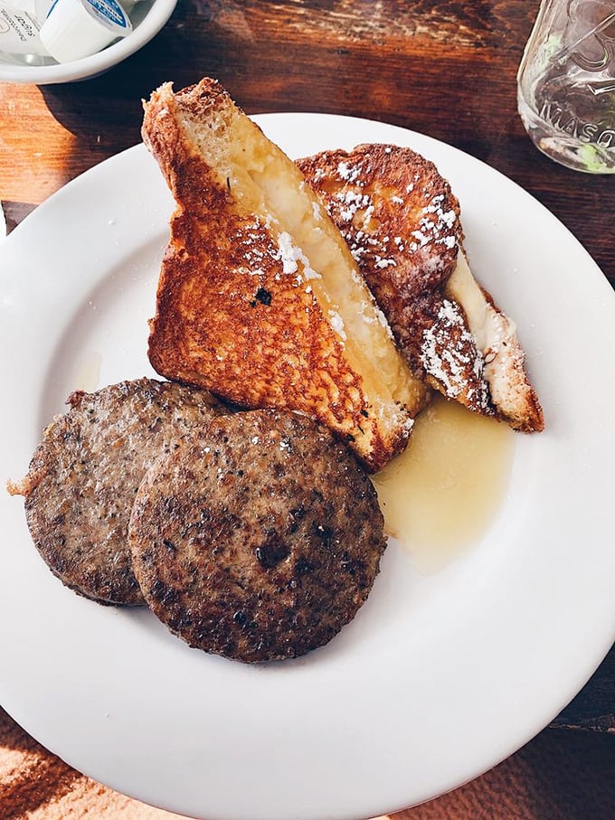 French toast that's been to finishing school—golden, crispy exterior with a custardy center that would make a pastry chef weep with joy.