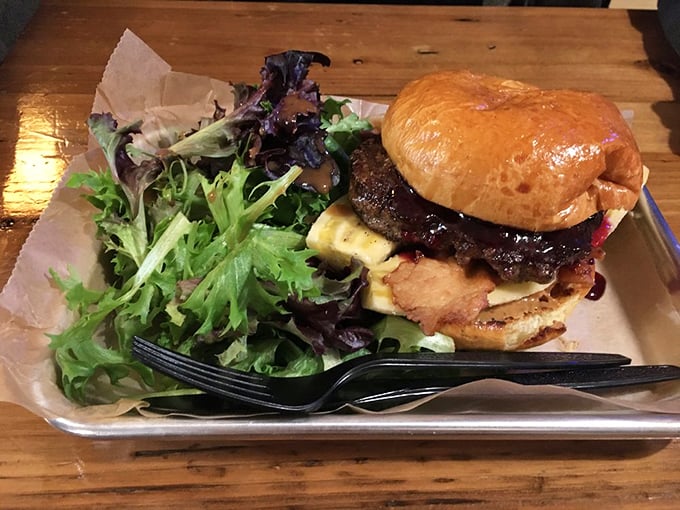 Breakfast meets burger in this morning masterpiece. The egg isn't just a topping—it's the crown jewel in this handheld kingdom.