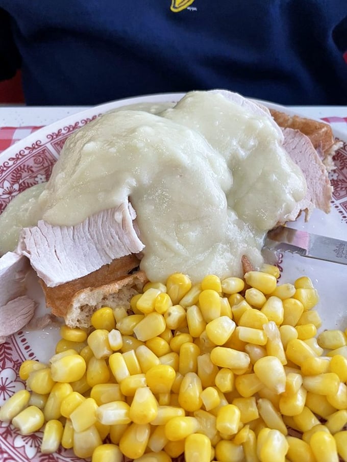 Turkey croquettes smothered in gravy with a side of sweet corn—like Thanksgiving decided to visit on a random Tuesday.