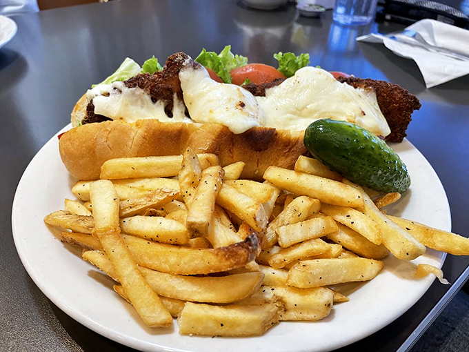 This sandwich isn't just a meal, it's an engineering marvel—crispy chicken, melty cheese, and golden fries that deserve their own spotlight.