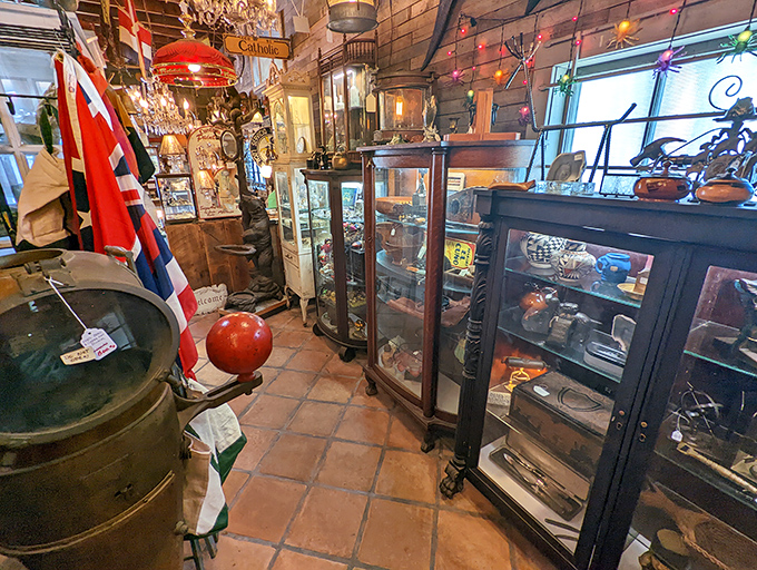 Nautical flags and British ensigns stand guard over glass cabinets filled with maritime treasures – like a museum where everything has a price tag.