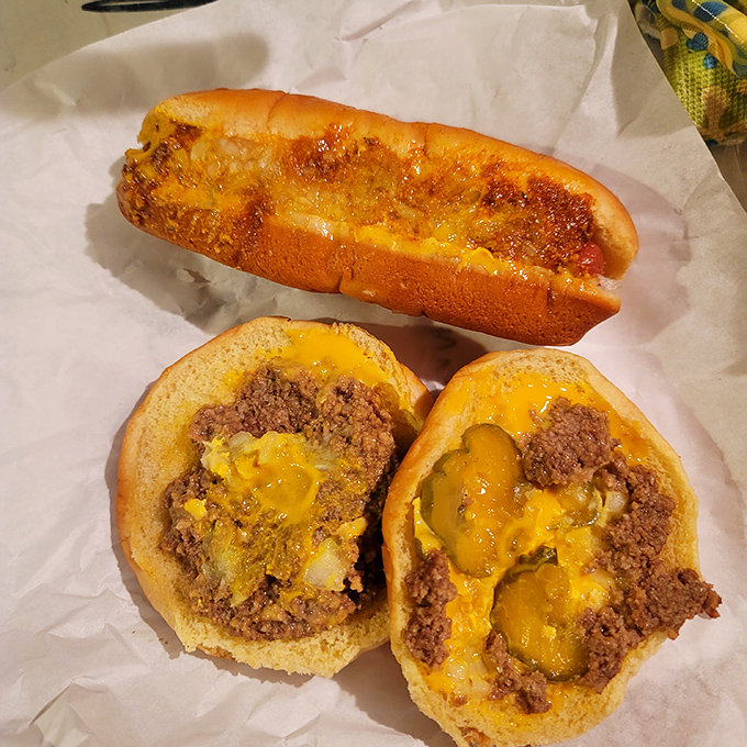 The legendary zip burger in all its glory—loose meat perfection nestled in a soft bun with melty cheese and pickles playing backup.